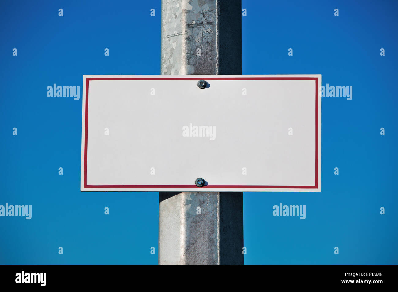 Blank metallic plate for textspace on post on blue sky background Stock ...