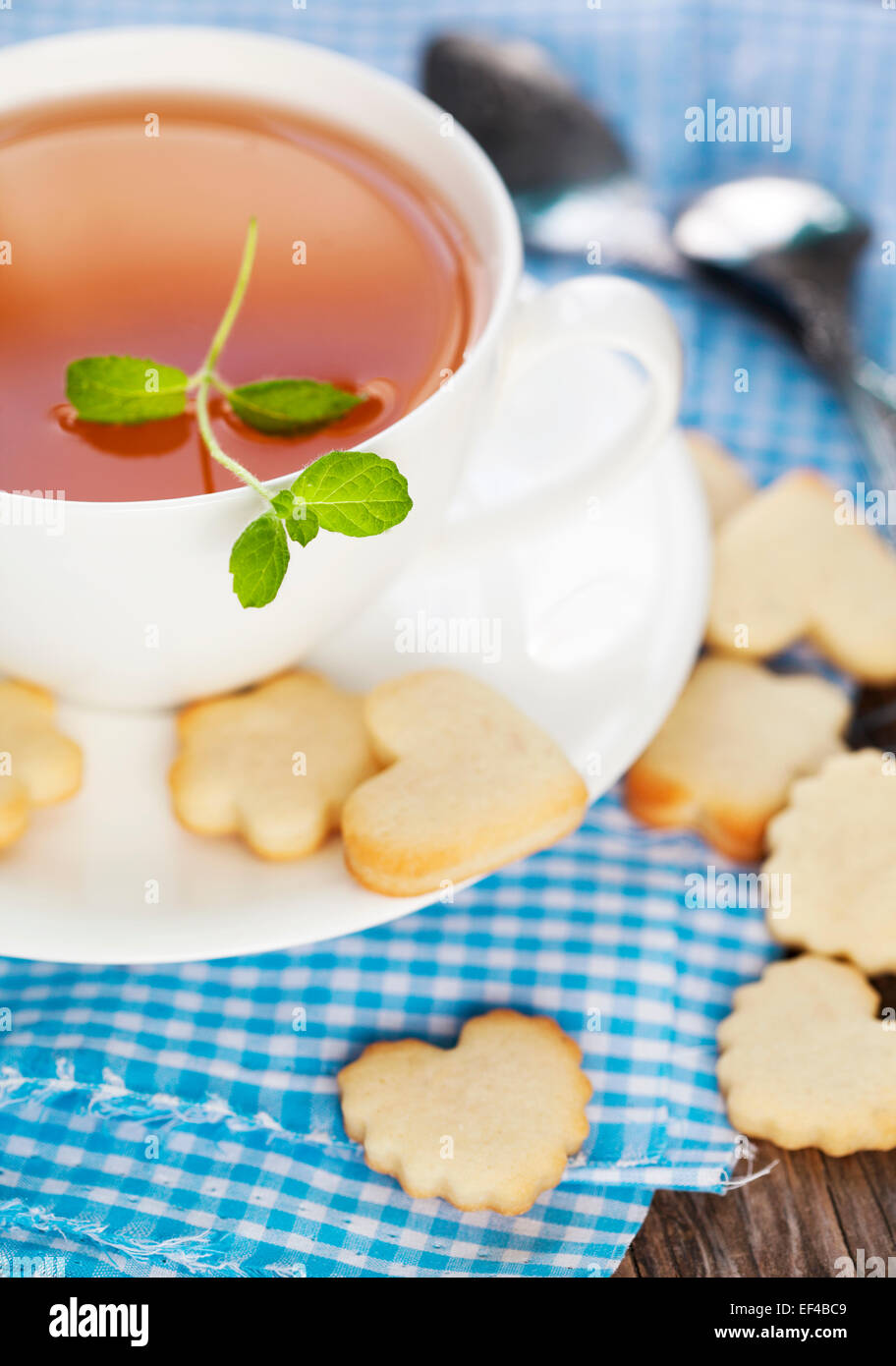 Cup of tea and sugar cookies Stock Photo - Alamy