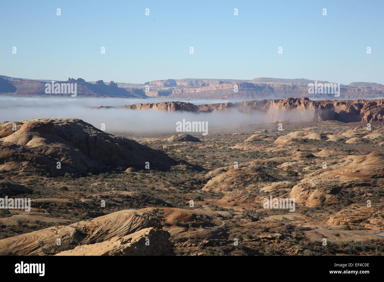 inversion fog after sunrise in arches national park, utah photo by jen ...