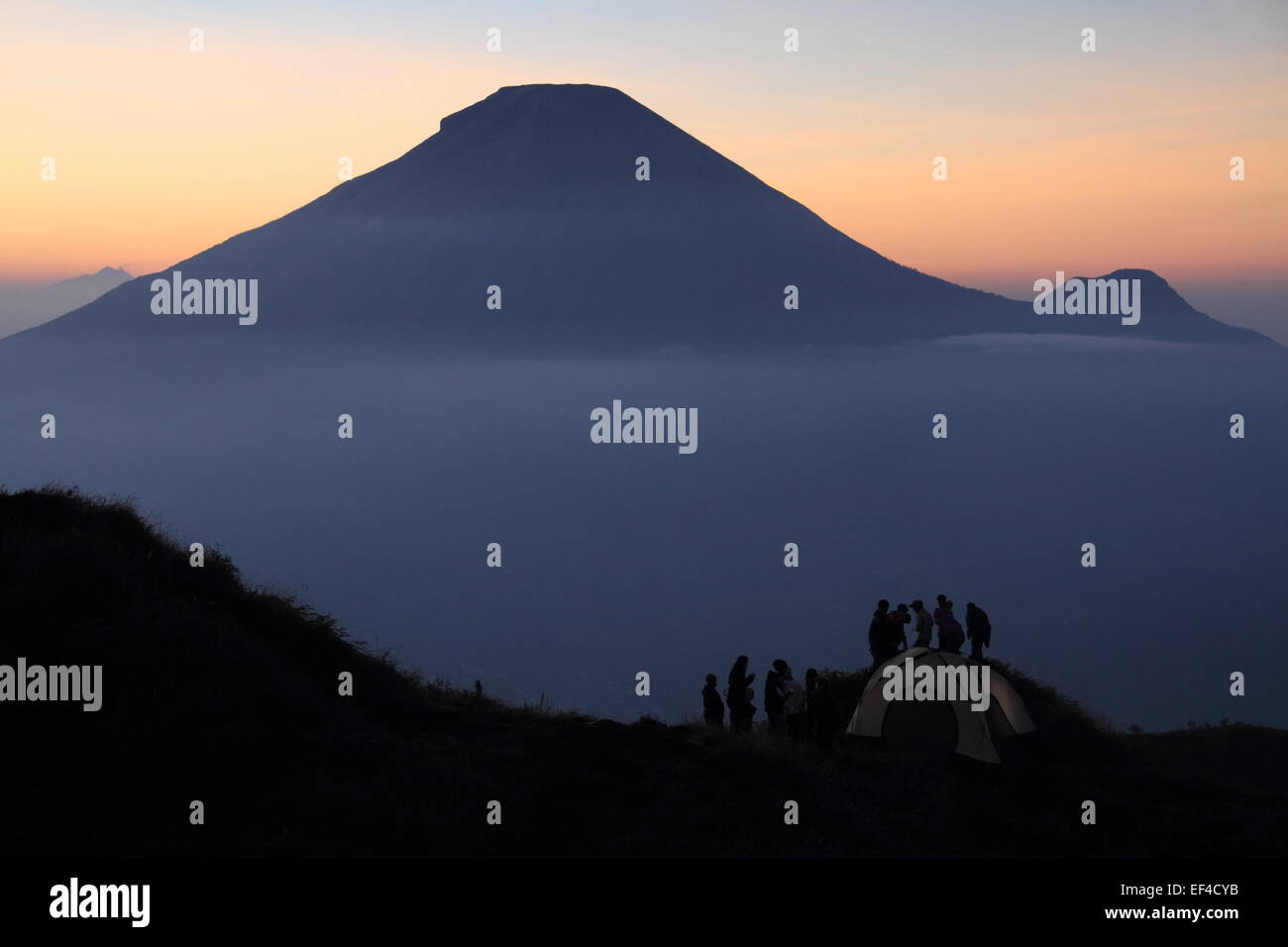 From the top of Mount Dieng mountain climbers waiting for the sunrise ...