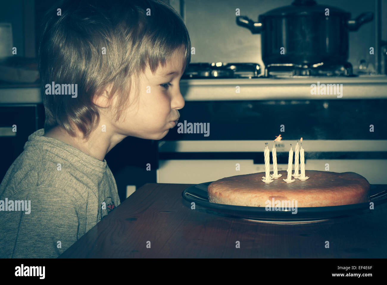Blowing out candles birthday cake hi-res stock photography and images ...
