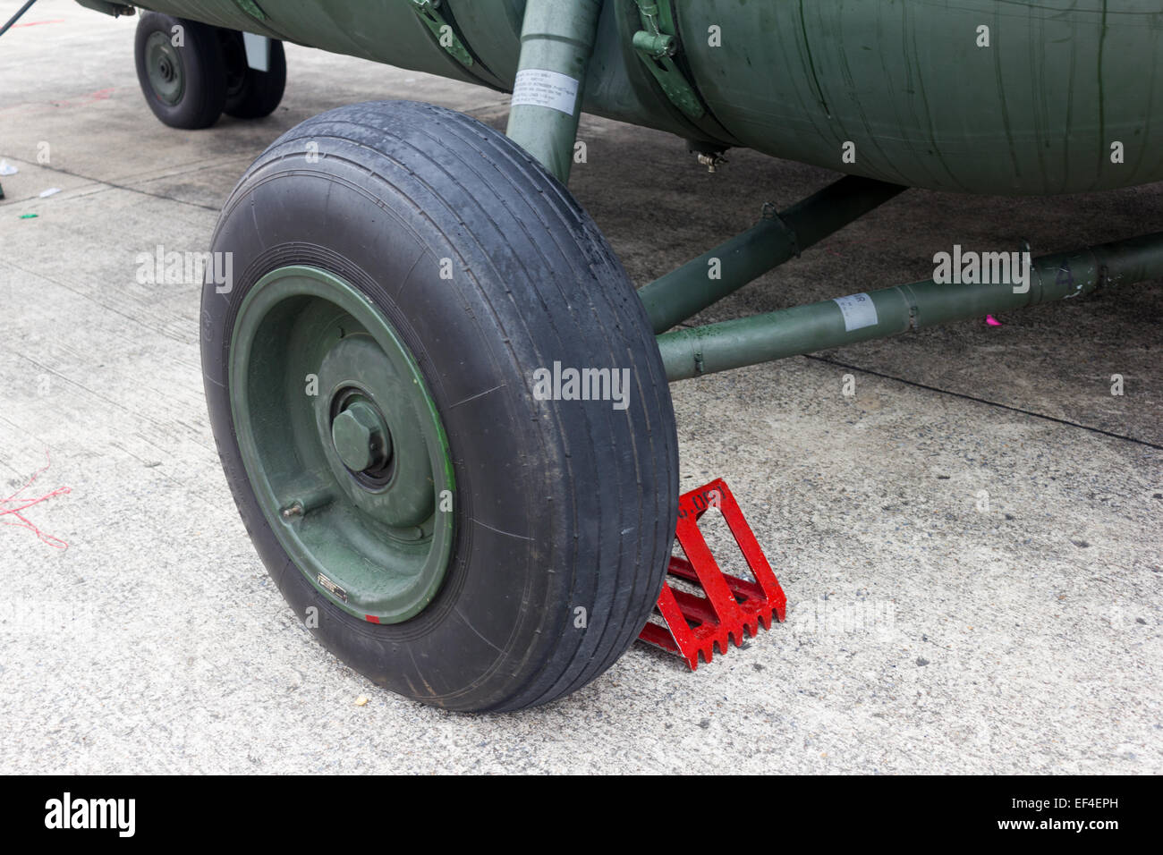 Military helicopter wheel on runway, view of left side aircraft Stock ...