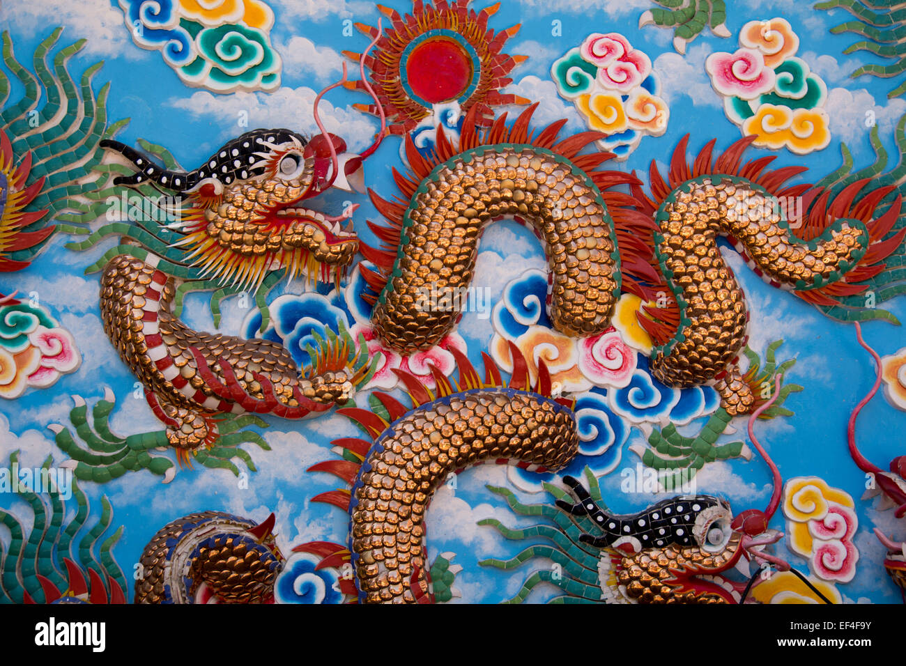 The Chinese Dragon pattern on red wall Stock Photo - Alamy