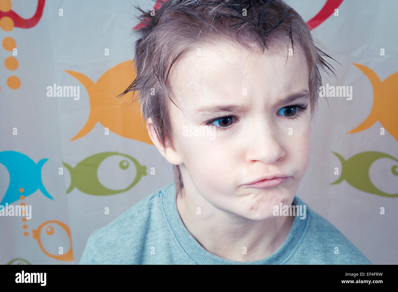 Young boy in bathroom making a face Stock Photo - Alamy