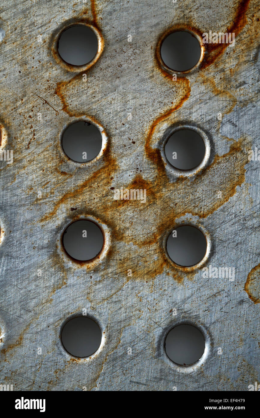 metal texture with holes, abstract background Stock Photo - Alamy