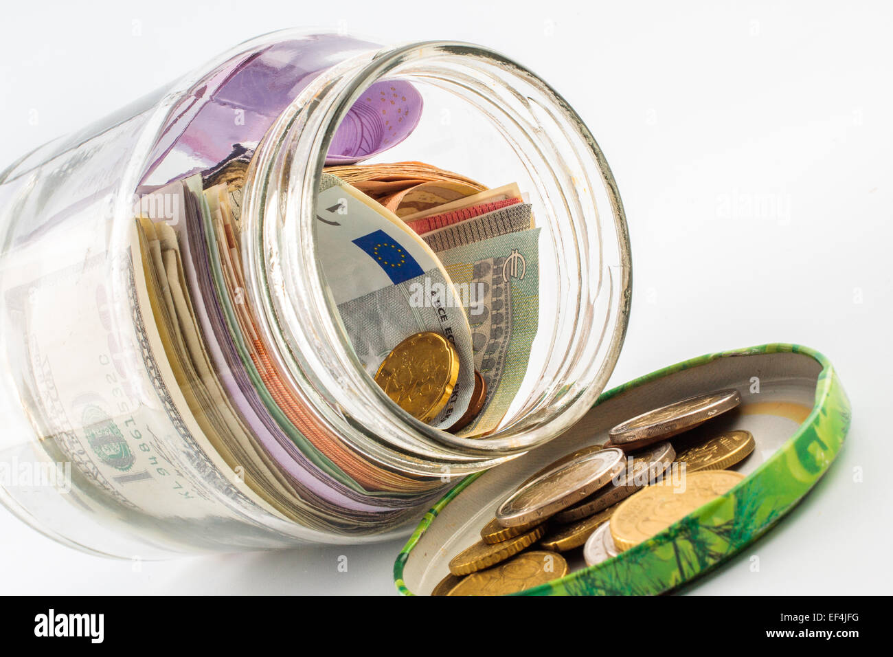 A jar of cash on the white background Stock Photo - Alamy