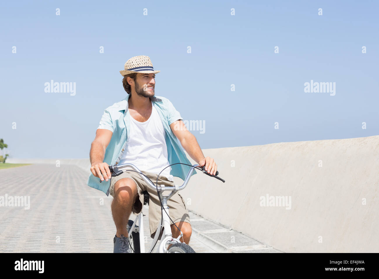 Handsome man on a bike ride Stock Photo - Alamy