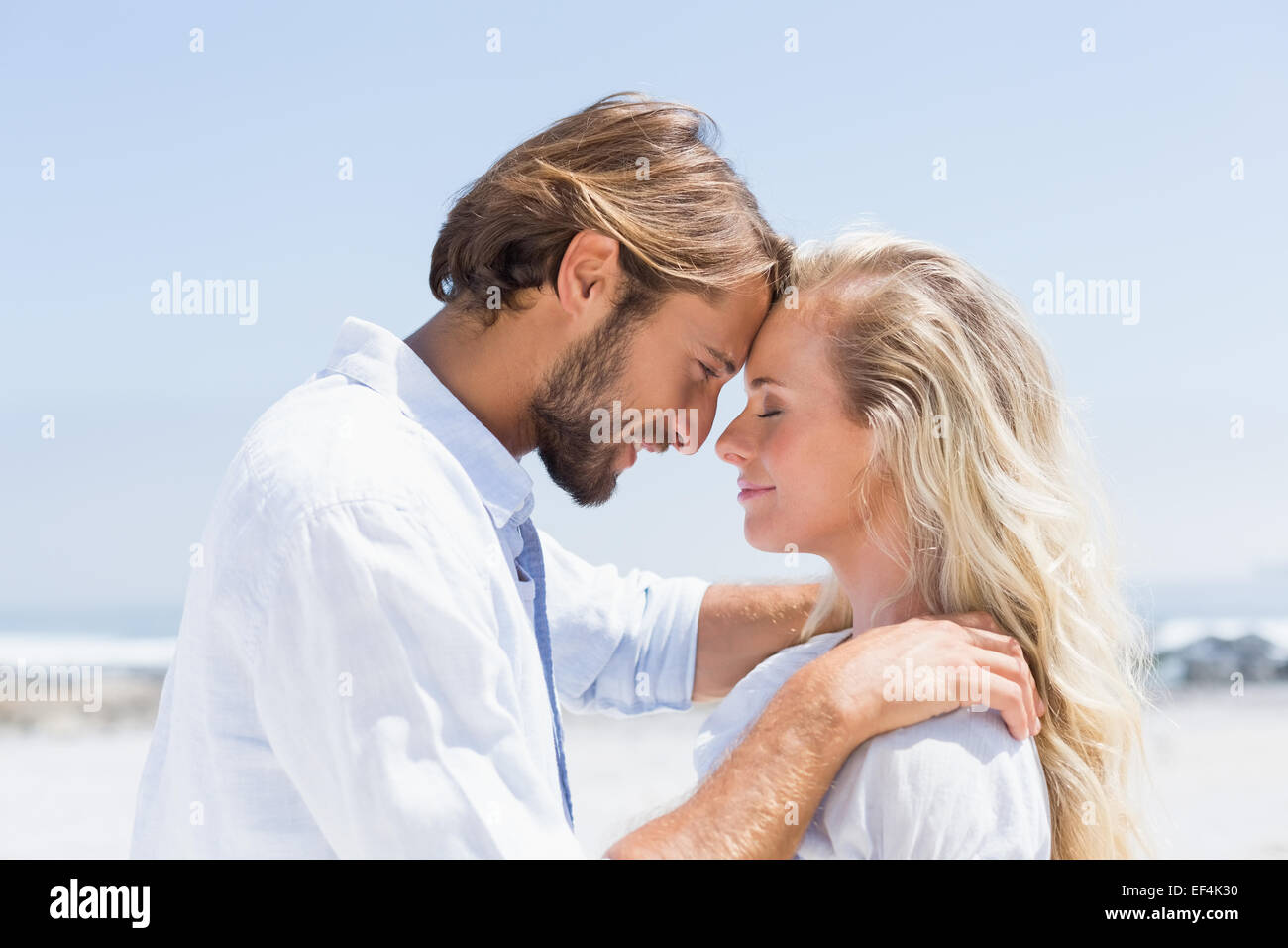 Cute couple hugging on the beach Stock Photo - Alamy