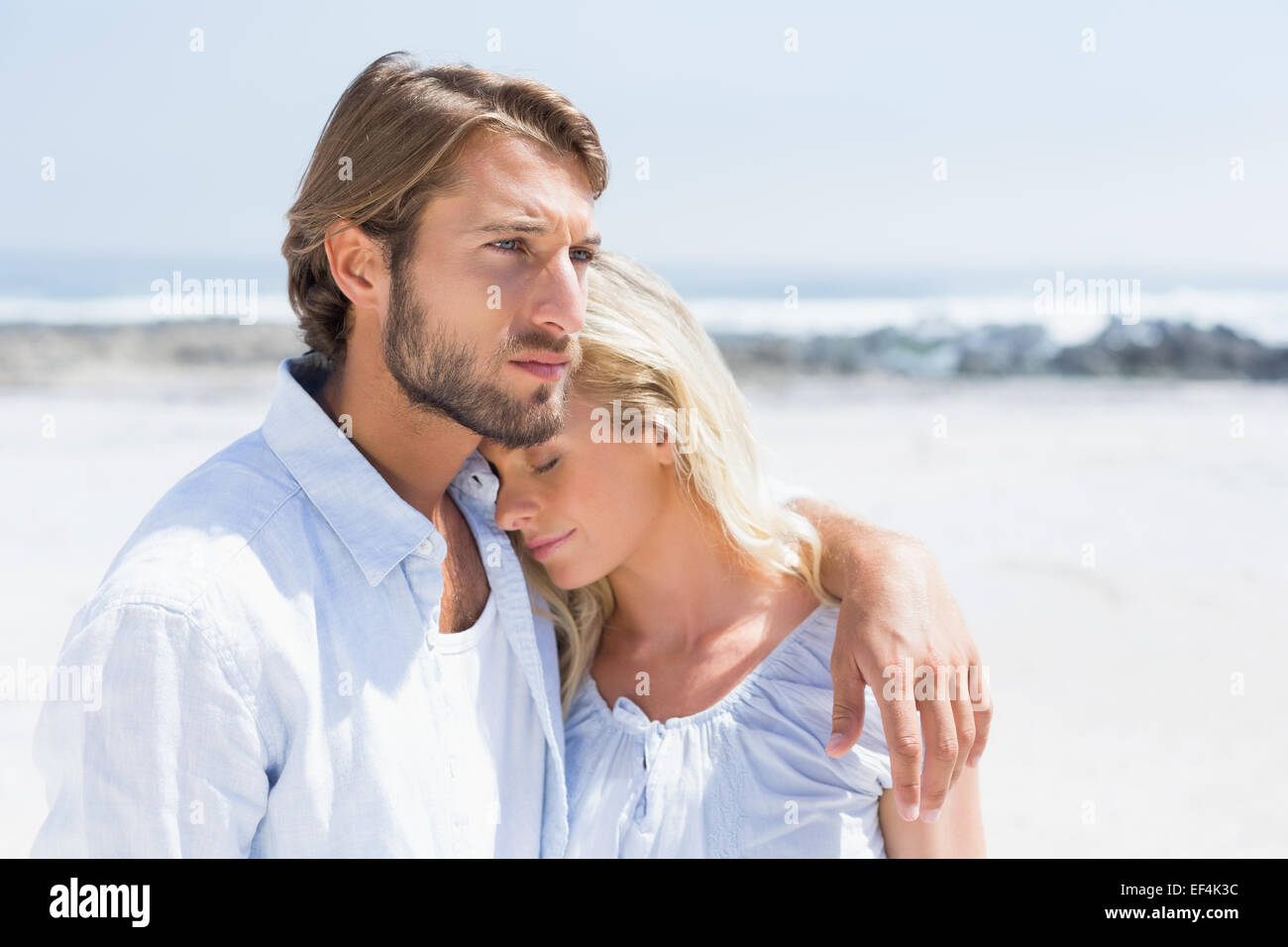 Cute couple hugging on the beach Stock Photo - Alamy