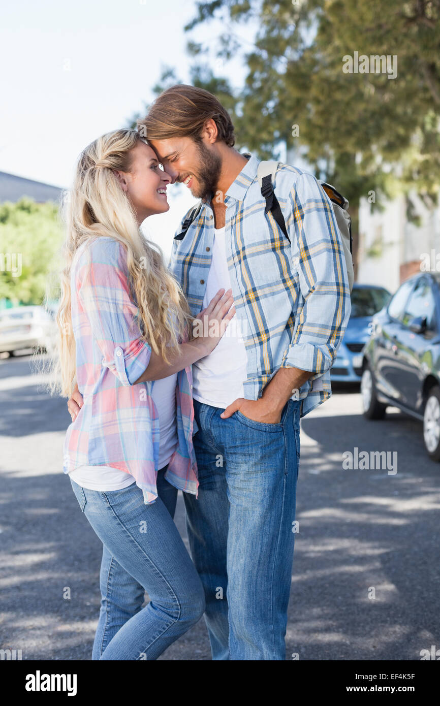 Attractive couple standing and hugging Stock Photo - Alamy