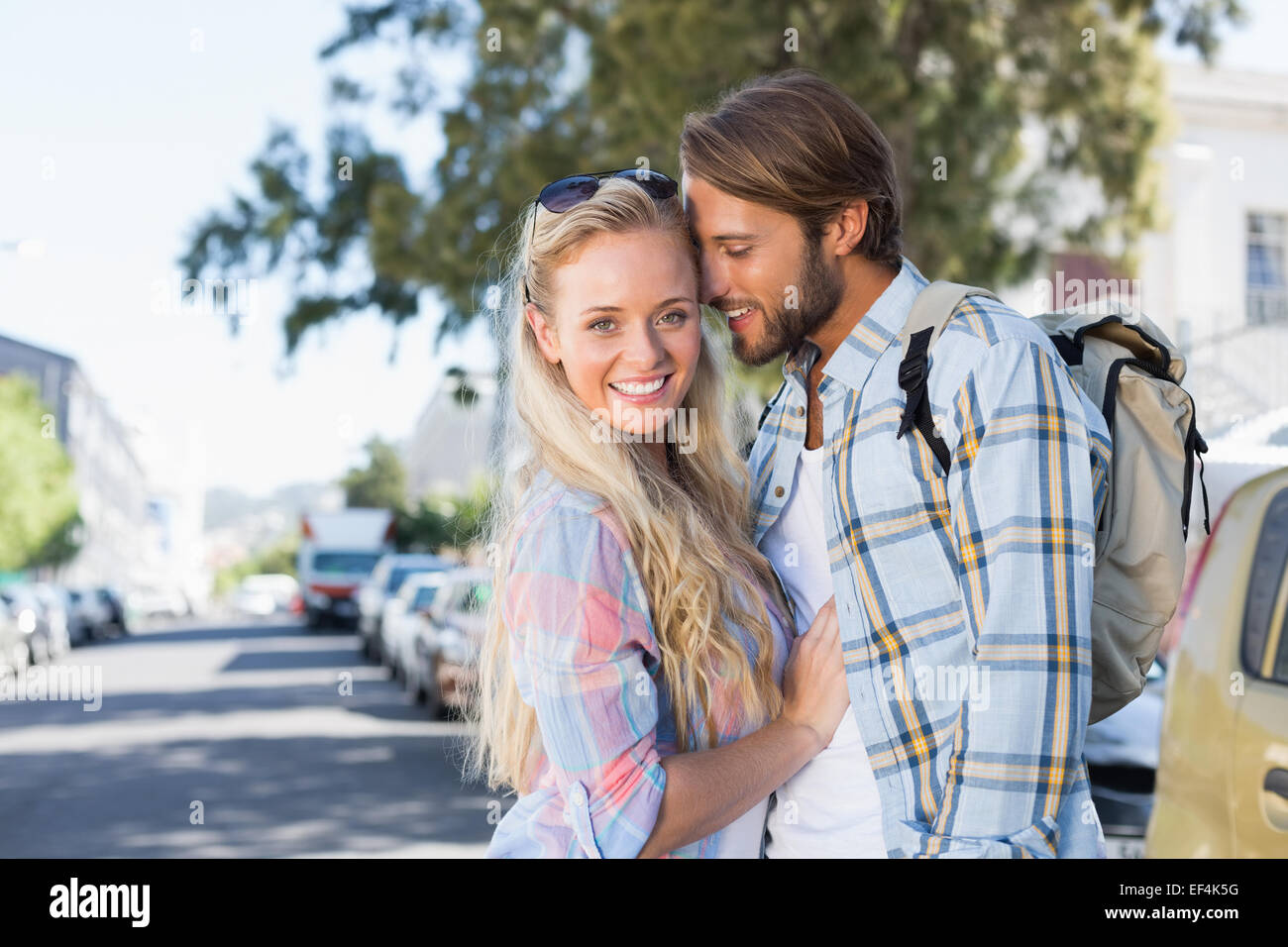 Attractive couple standing and hugging Stock Photo - Alamy