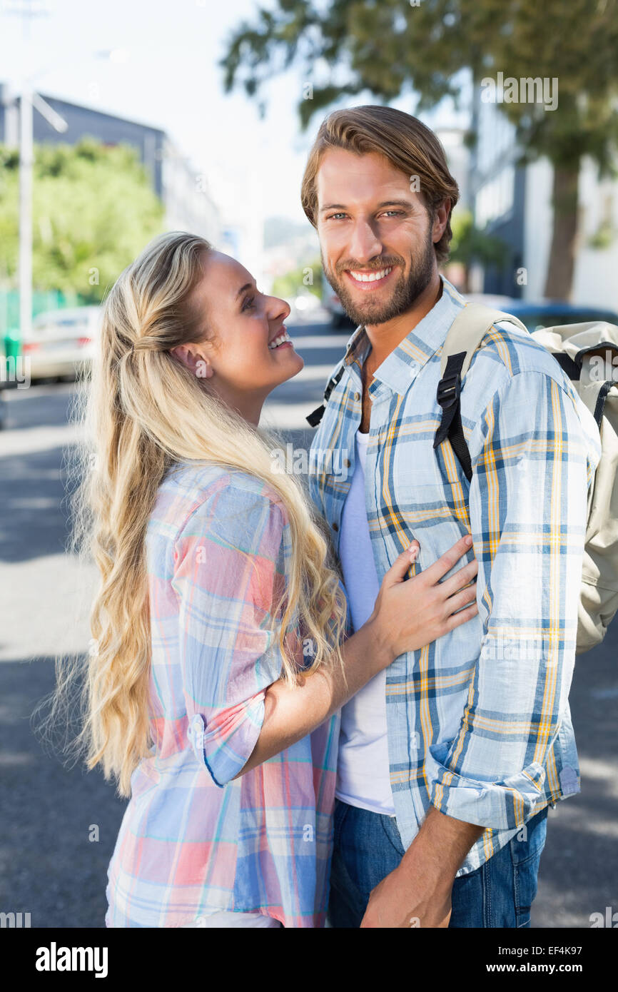 Attractive couple standing and hugging Stock Photo - Alamy