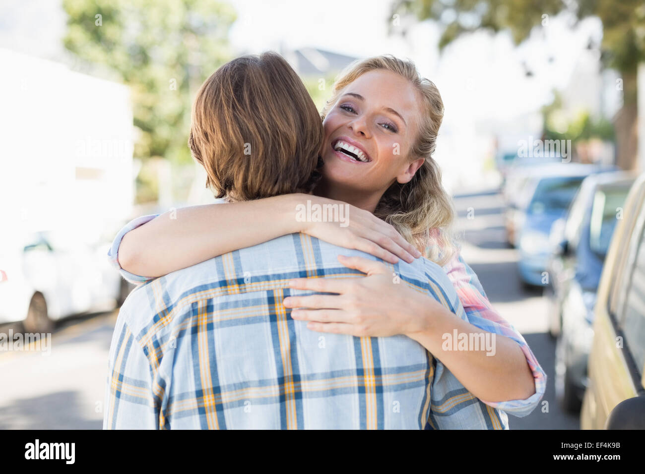 Attractive couple standing and hugging Stock Photo - Alamy