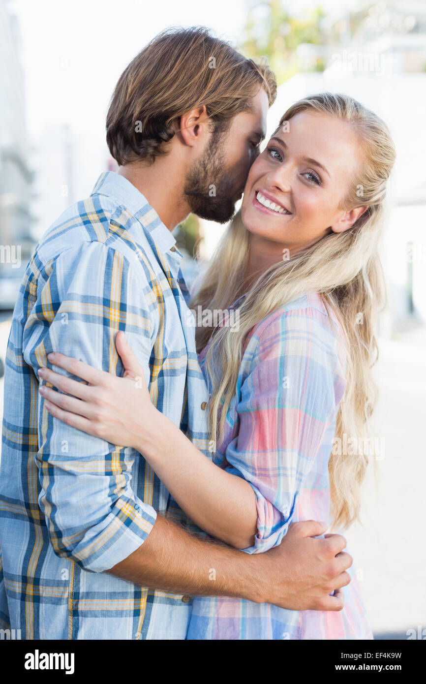 Attractive couple standing and hugging Stock Photo - Alamy