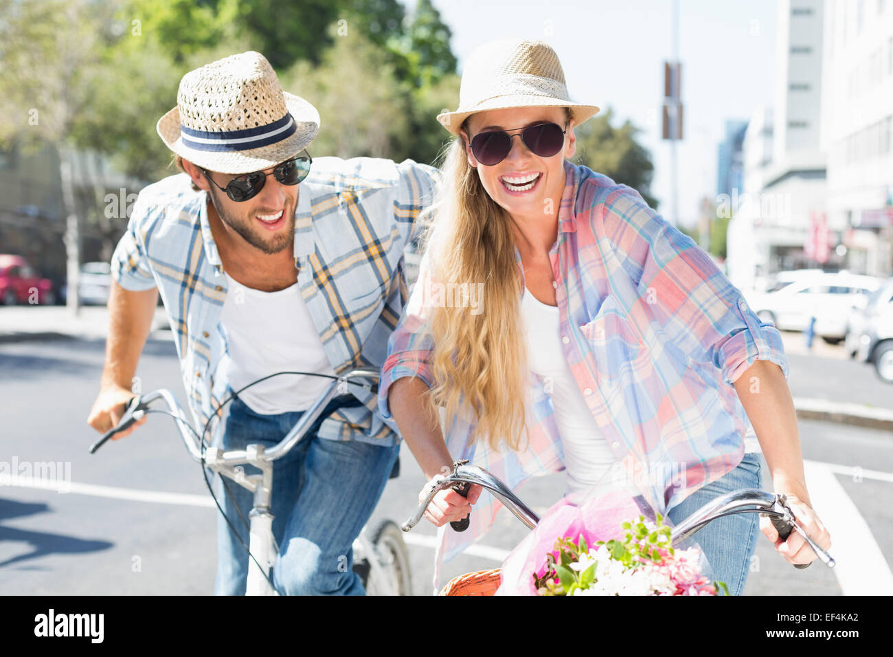 Attractive couple on a bike ride Stock Photo - Alamy