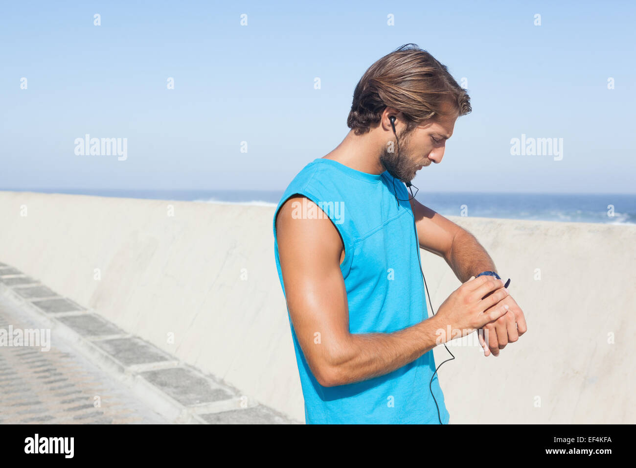 Fit man jogging on promenade Stock Photo - Alamy