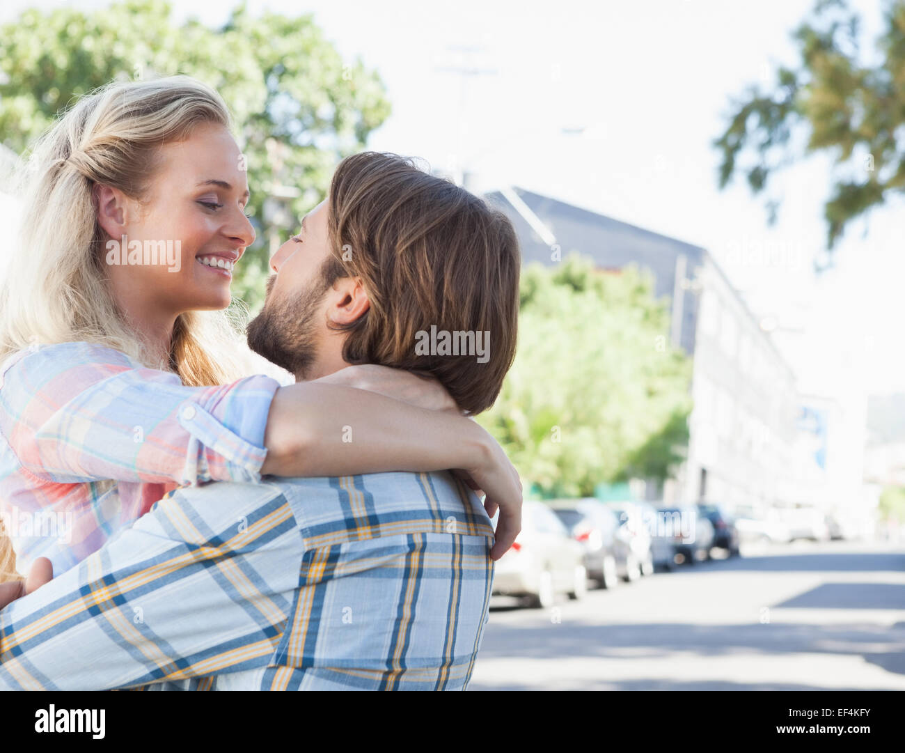 Cute couple standing and hugging Stock Photo - Alamy