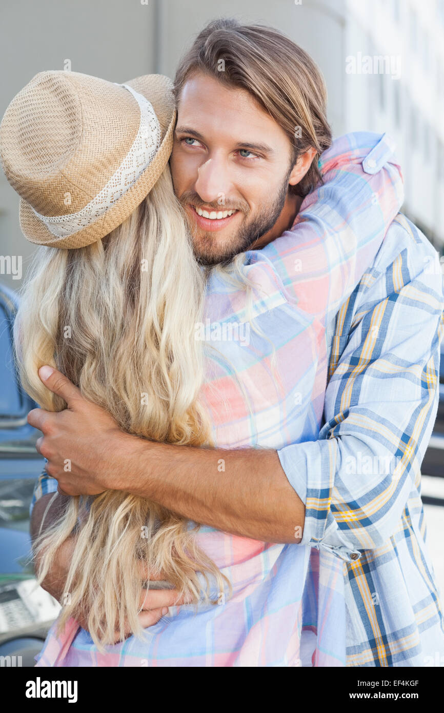 Cute couple standing and hugging Stock Photo - Alamy
