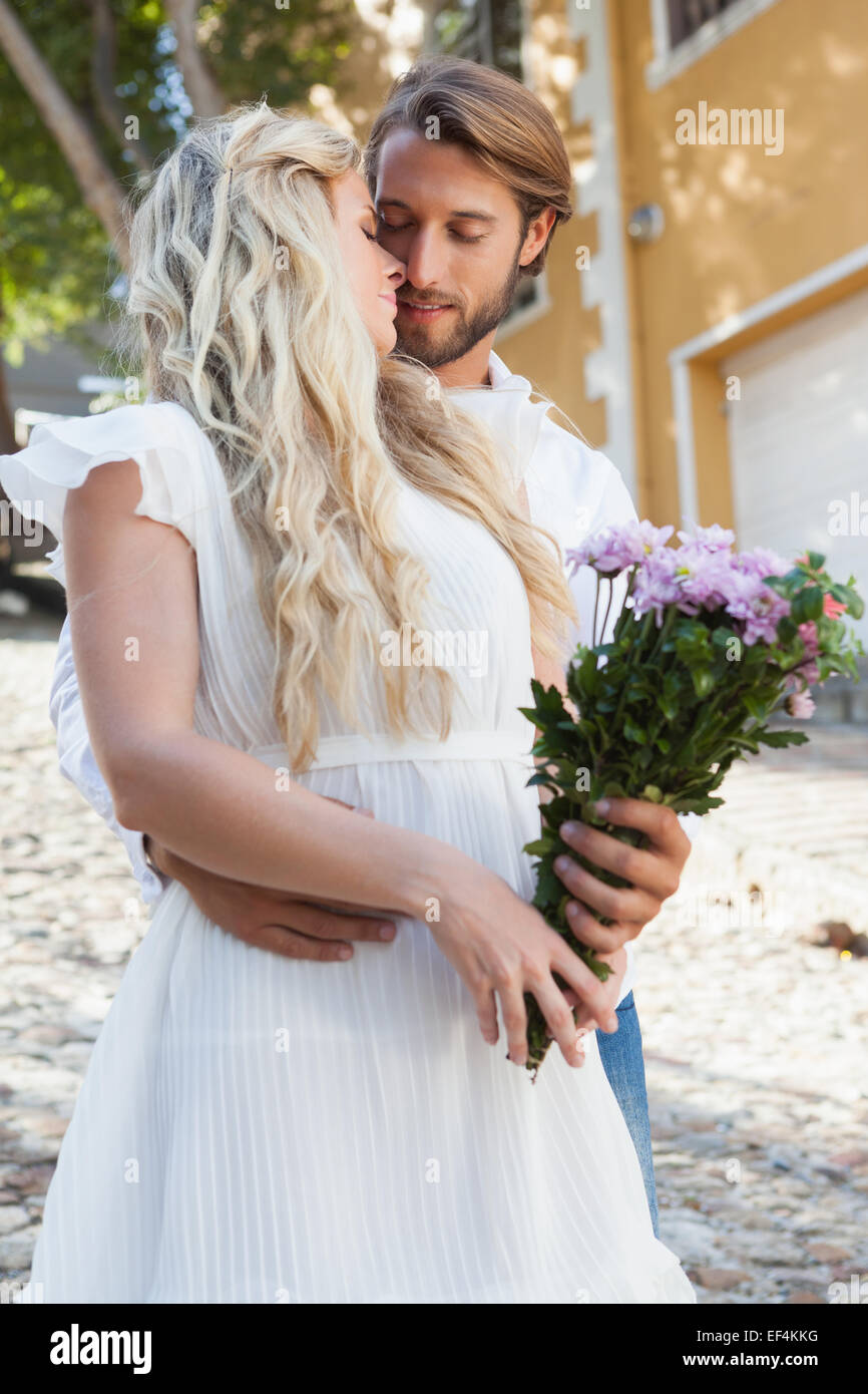 Cute couple hugging and smiling Stock Photo - Alamy