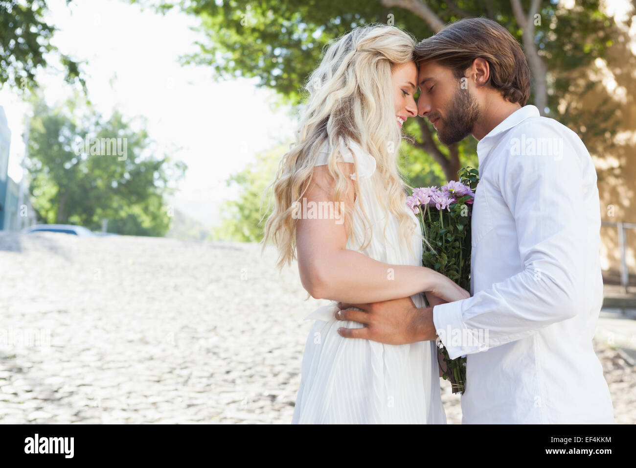 Cute couple hugging and smiling Stock Photo - Alamy