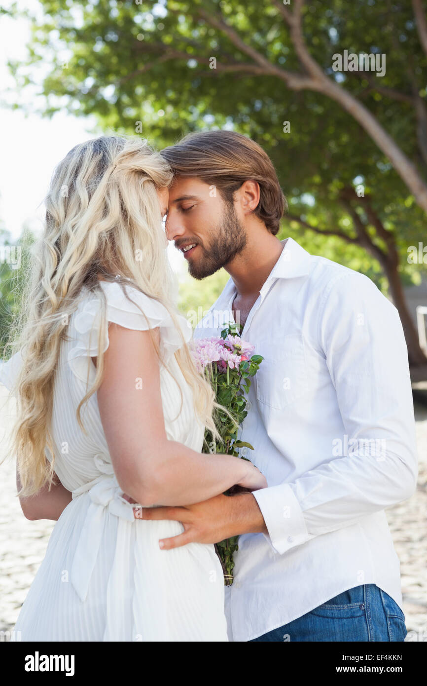 Cute couple hugging and smiling Stock Photo - Alamy