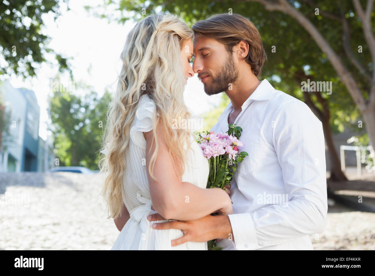 Cute couple hugging and smiling Stock Photo - Alamy