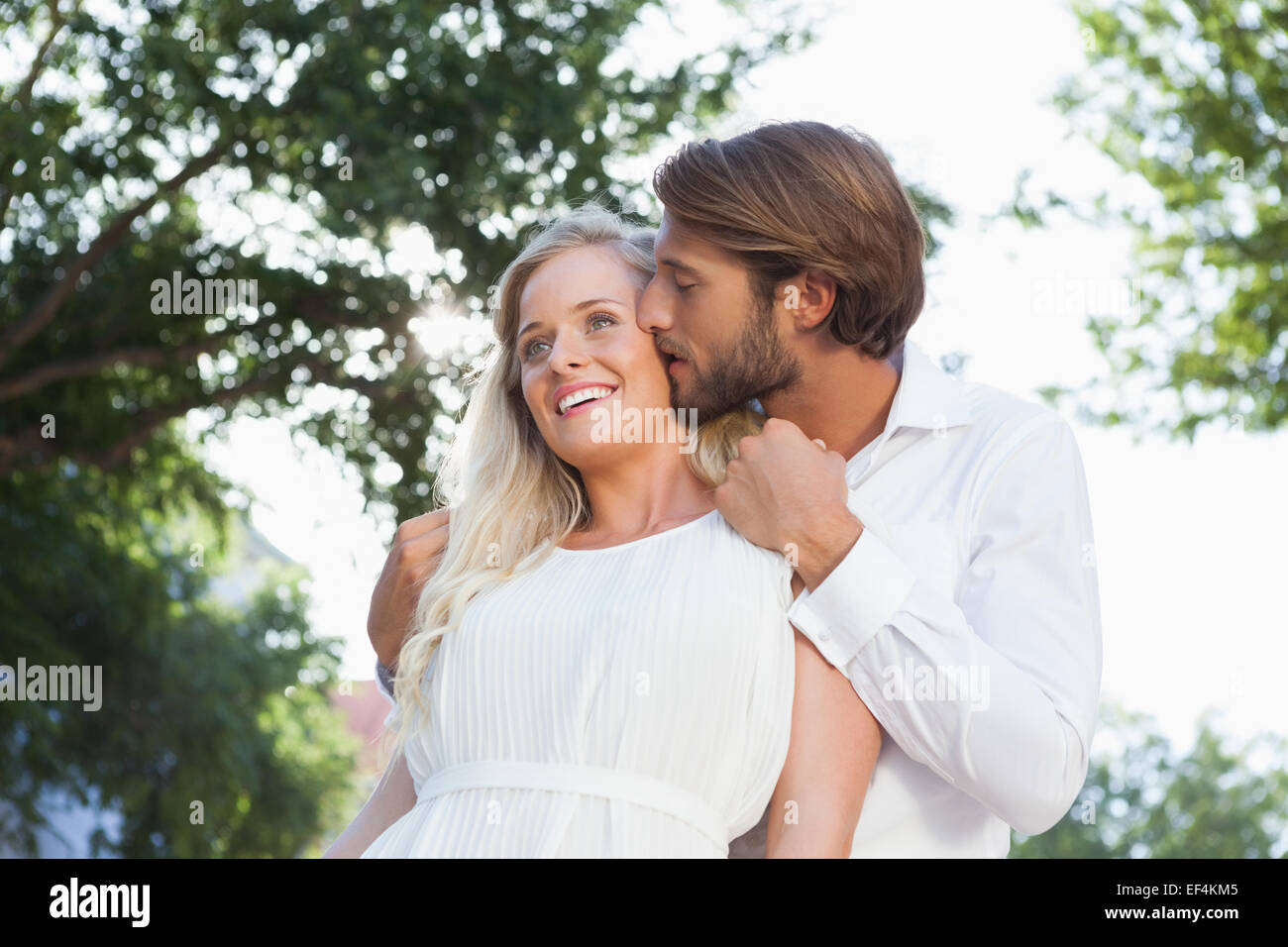 Cute couple hugging and smiling Stock Photo - Alamy