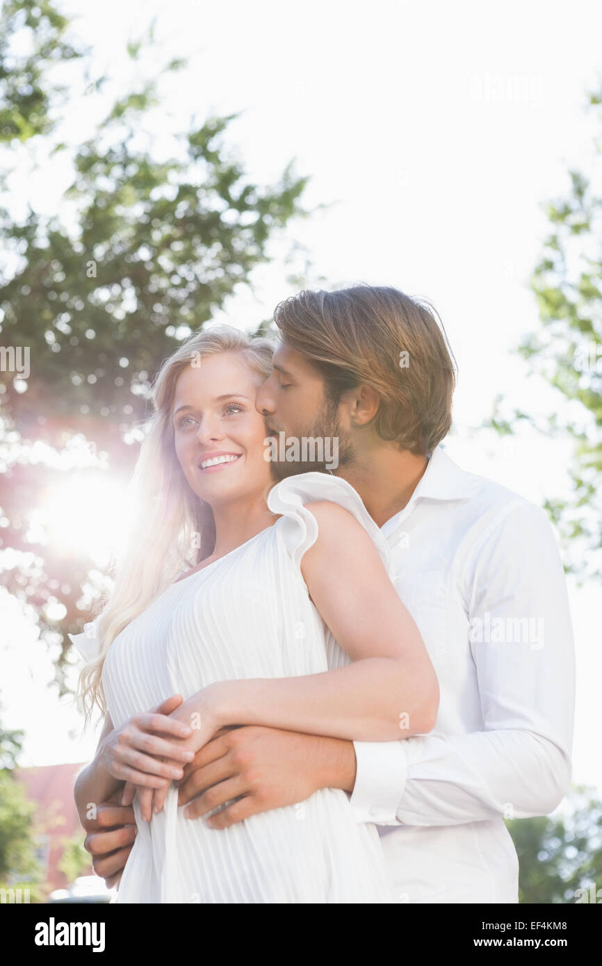 Cute couple hugging and smiling Stock Photo - Alamy