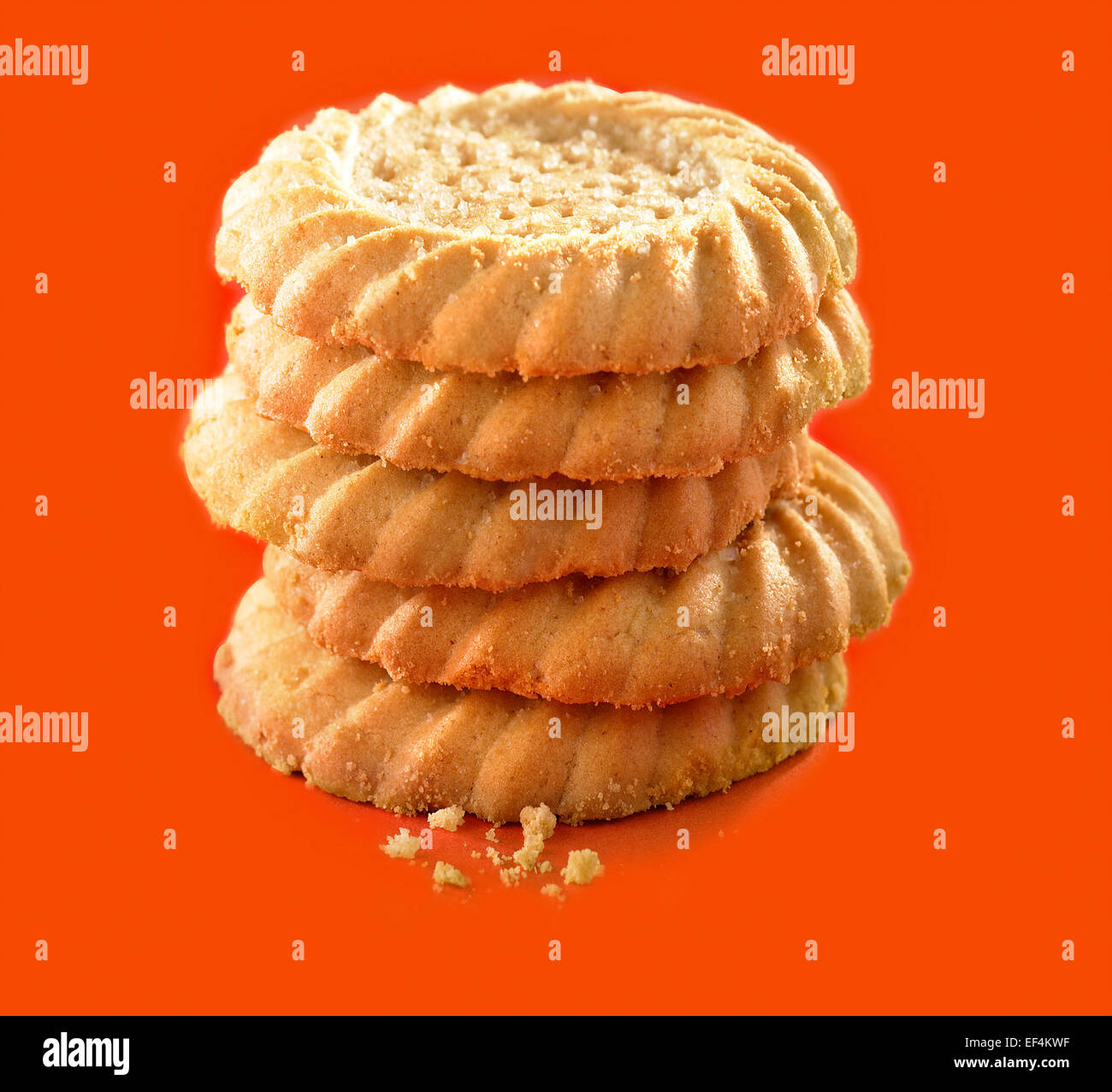 A stack of biscuits with a few crumbs at the front Stock Photo - Alamy
