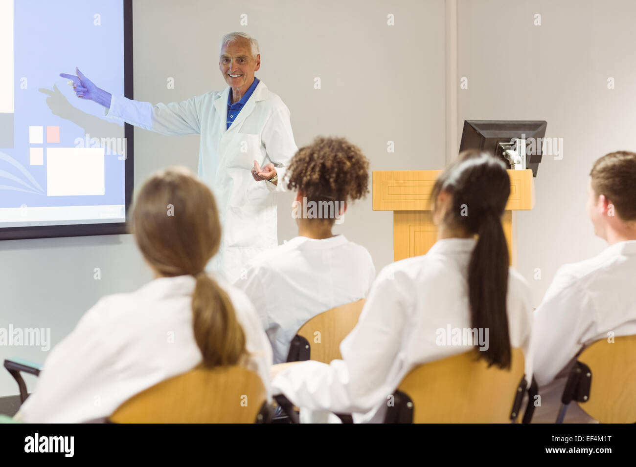 Science professor giving lecture to class Stock Photo - Alamy