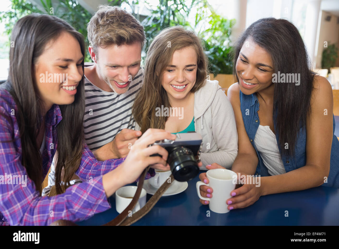 Young students looking at a camera Stock Photo - Alamy