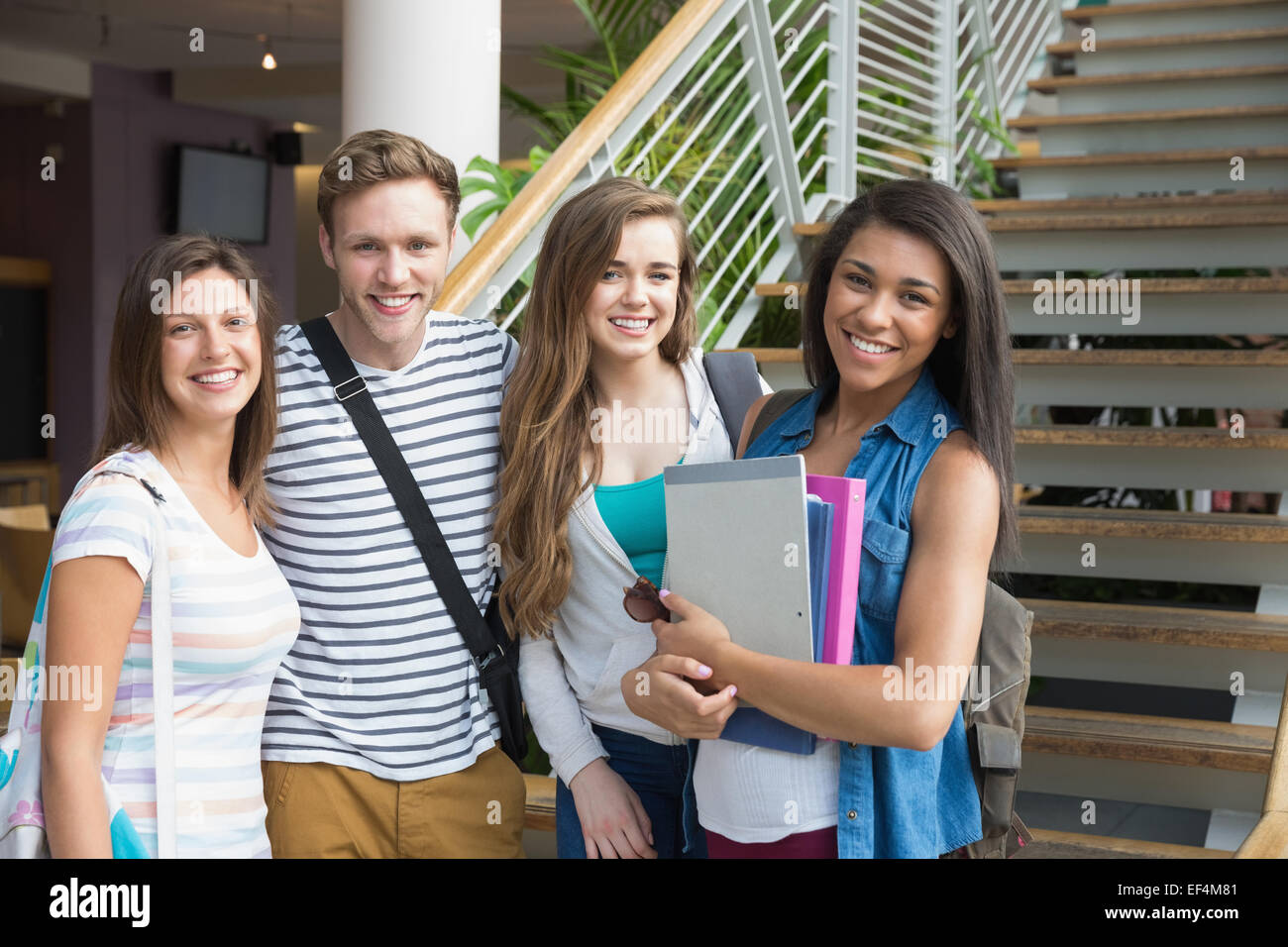 Smiling students looking at camera outside Stock Photo - Alamy