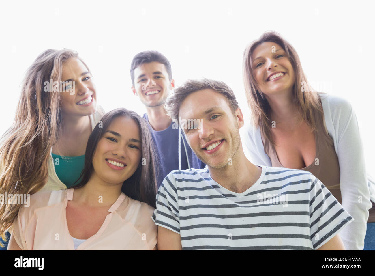 Happy students smiling at camera outside on campus Stock Photo - Alamy