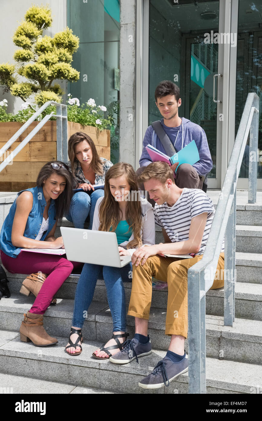 Students sitting on steps studying Stock Photo - Alamy