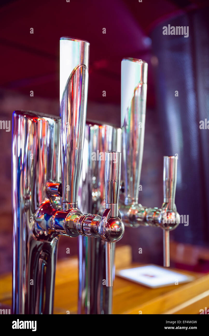 Shiny beer taps in a row Stock Photo - Alamy