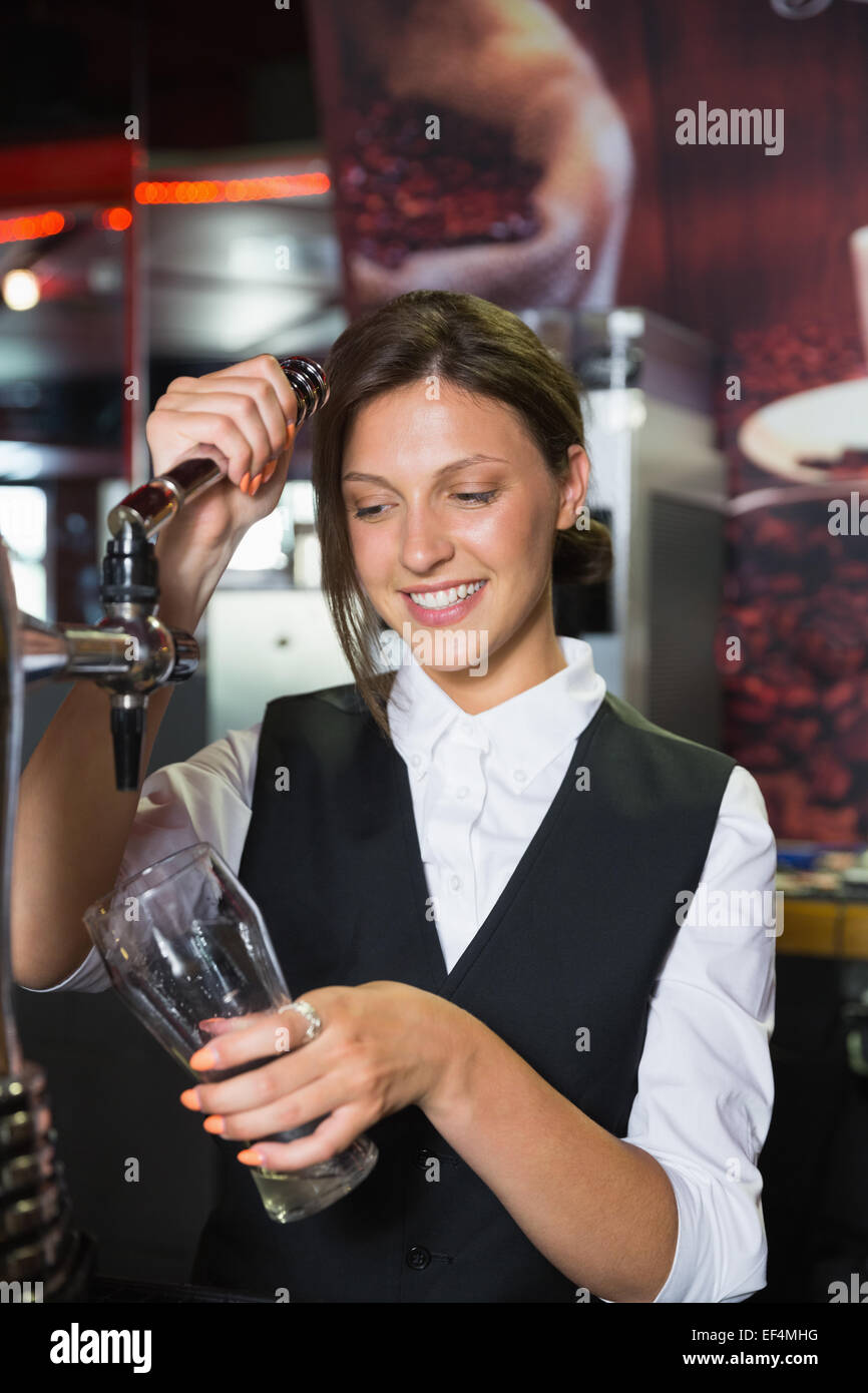 Happy barmaid pulling a pint of beer Stock Photo - Alamy