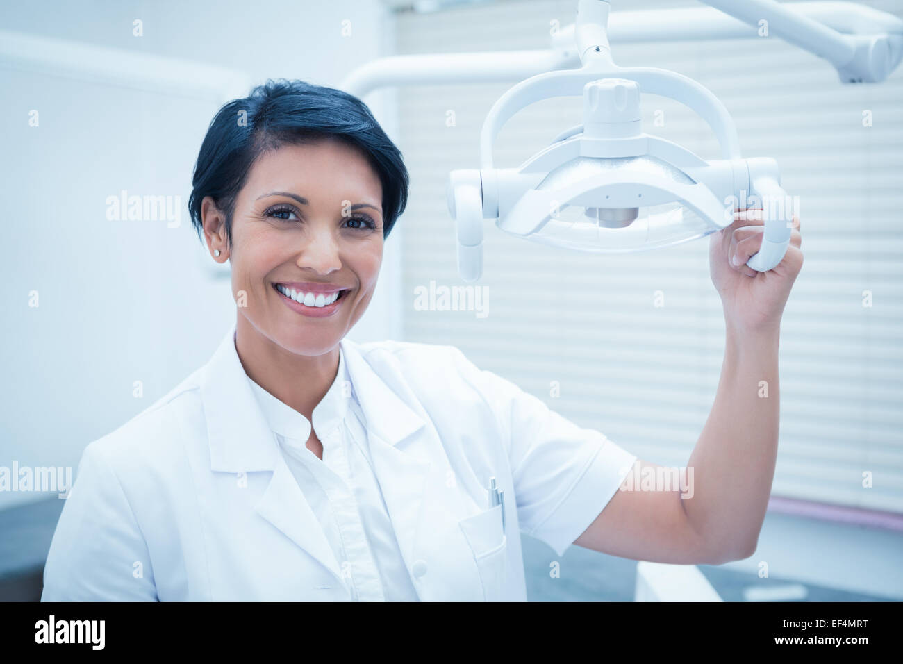 Smiling female dentist Stock Photo - Alamy