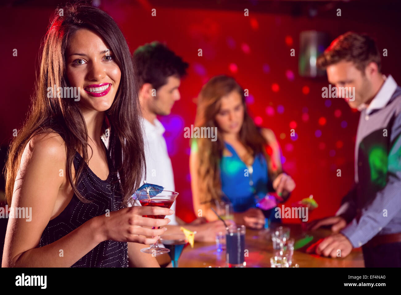 Happy friends on a night out together Stock Photo - Alamy