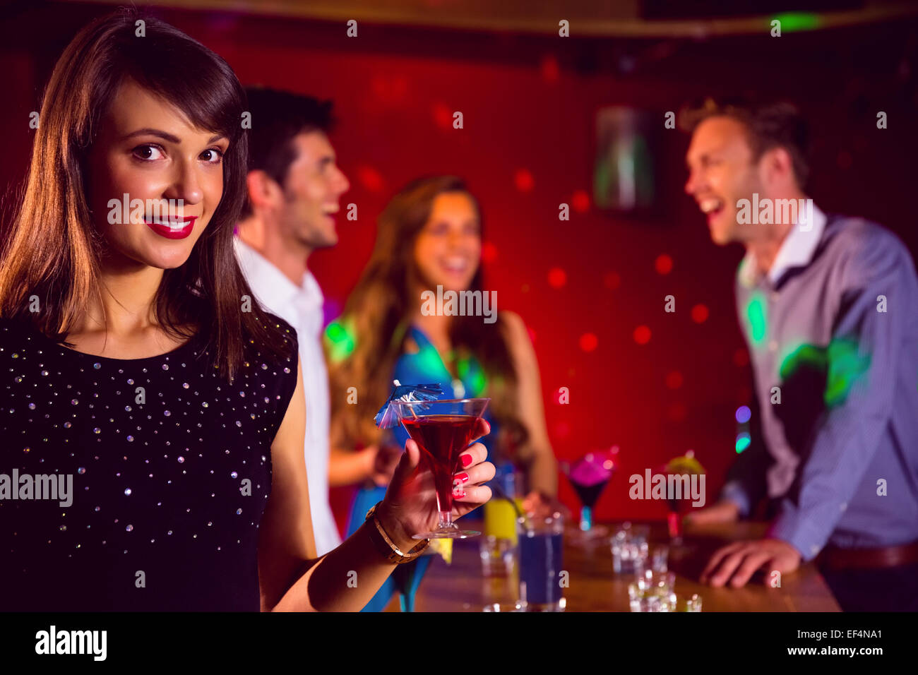 Happy friends on a night out together Stock Photo - Alamy