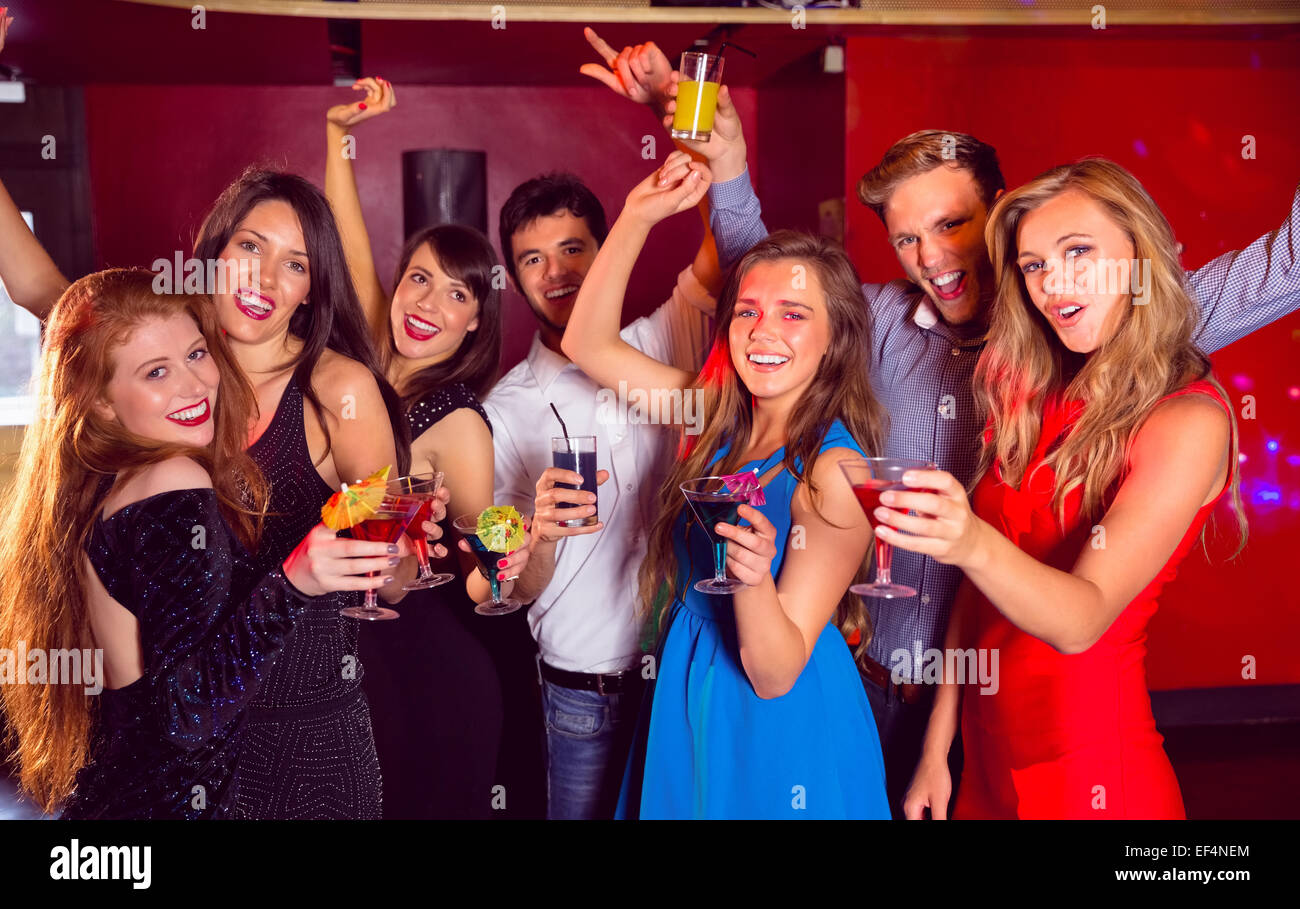 Happy friends on a night out together Stock Photo - Alamy