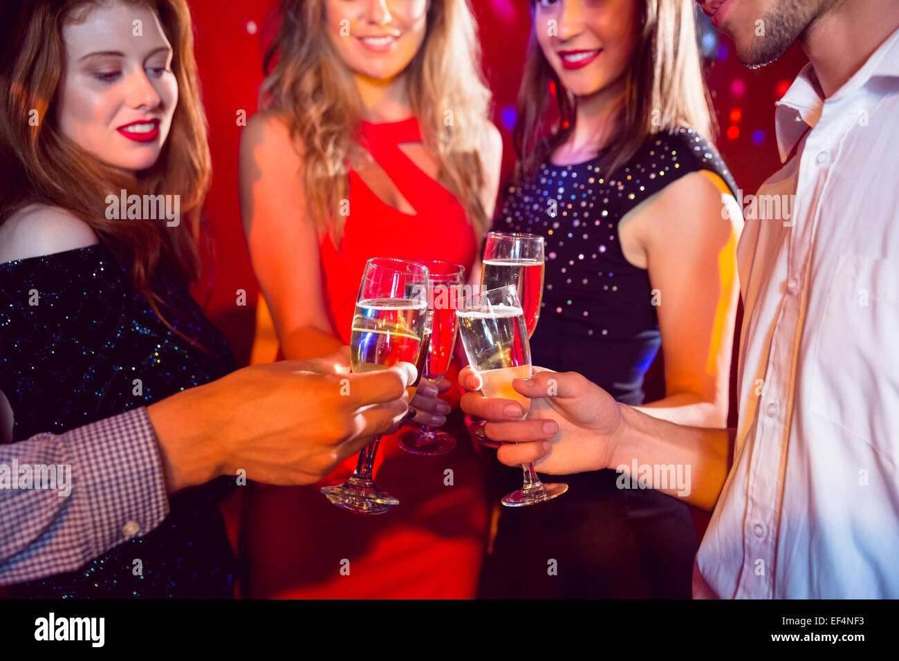 Happy friends on a night out together Stock Photo - Alamy