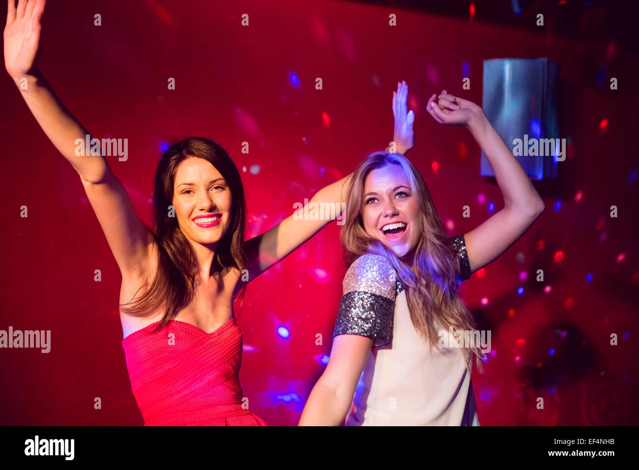 Pretty friends dancing and smiling Stock Photo - Alamy