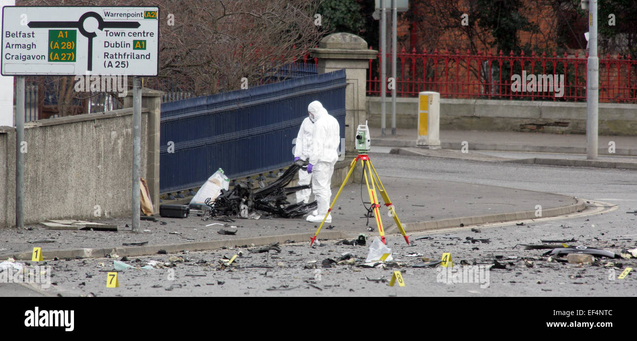 UNITED KINGDOM, Newry : Workmen repair damage buildings overlooking the ...