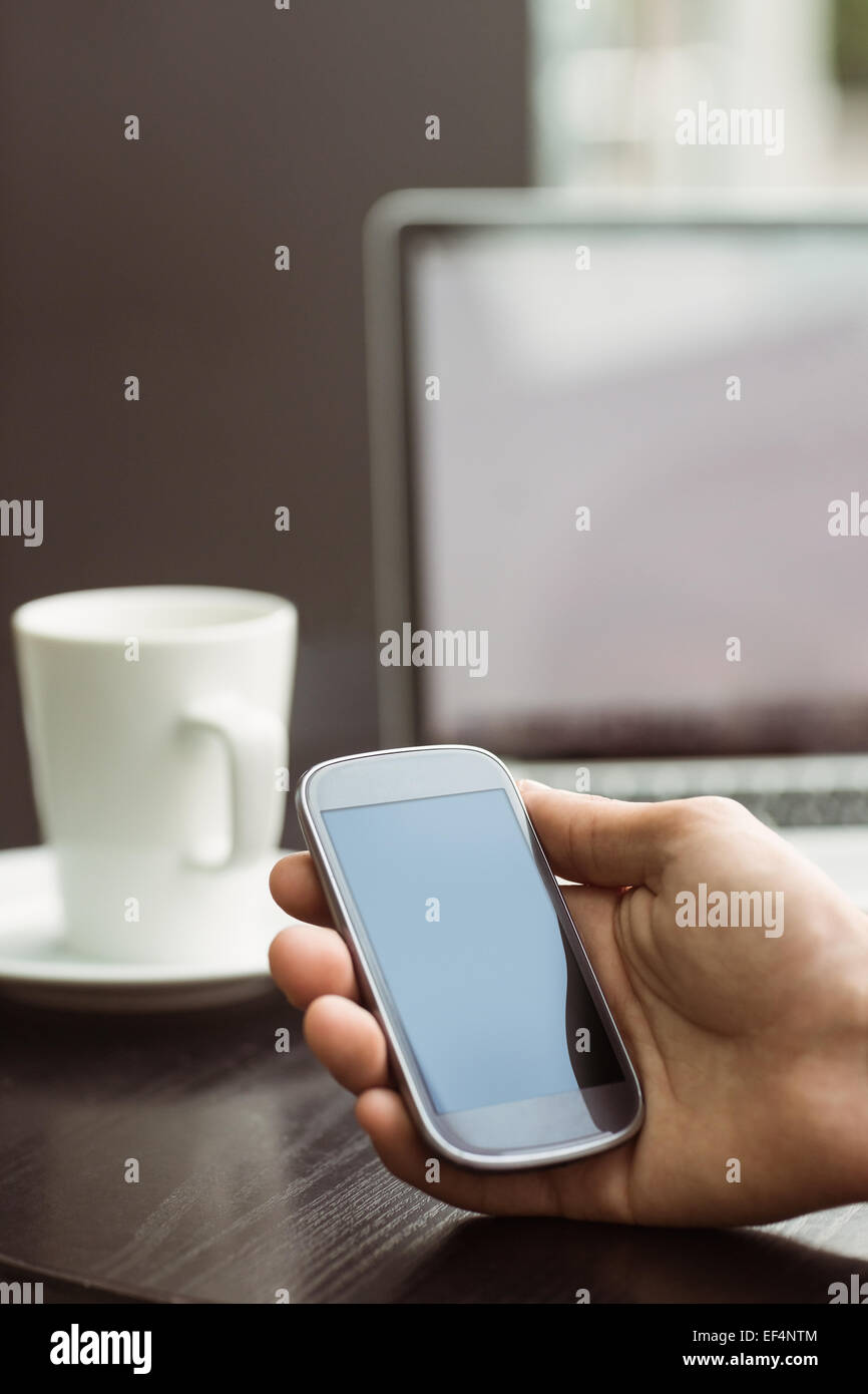 Student holding his mobile phone Stock Photo - Alamy