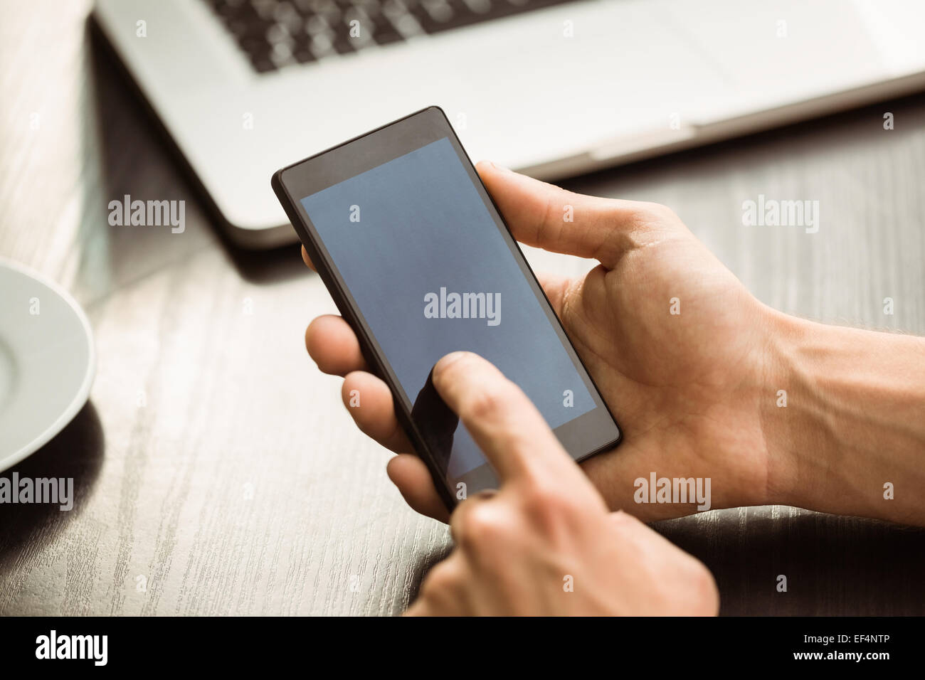 Student touching his mobile phone Stock Photo - Alamy