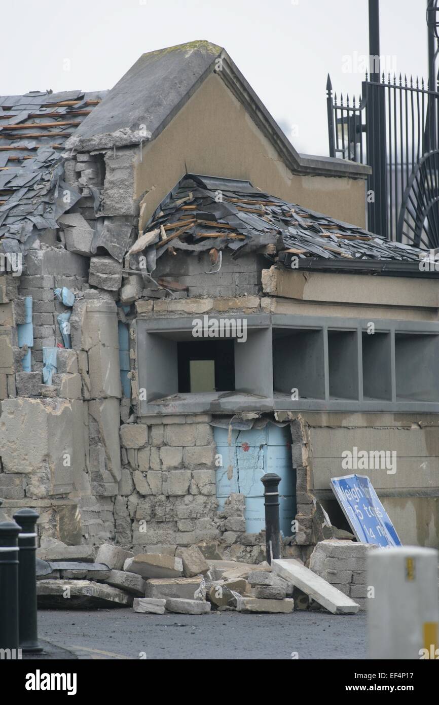 UNITED KINGDOM, Newry : Workmen repair damage buildings overlooking the ...
