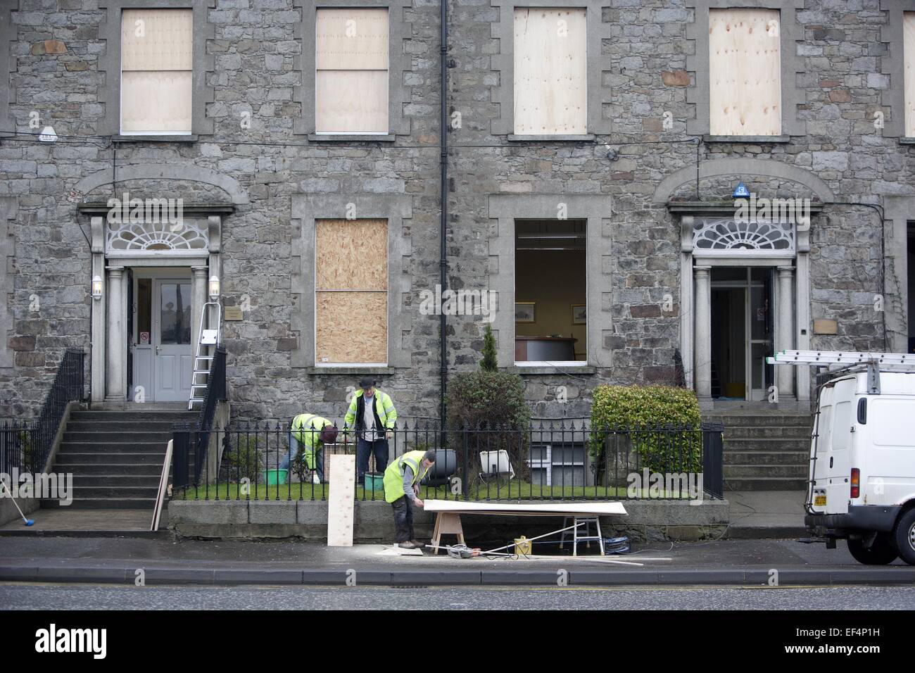 UNITED KINGDOM, Newry : Workmen repair damage buildings overlooking the ...