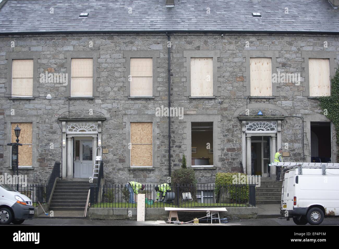 UNITED KINGDOM, Newry : Workmen repair damage buildings overlooking the ...