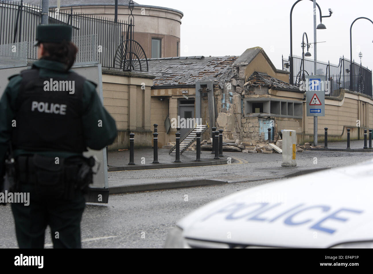UNITED KINGDOM, Newry : Workmen repair damage buildings overlooking the ...