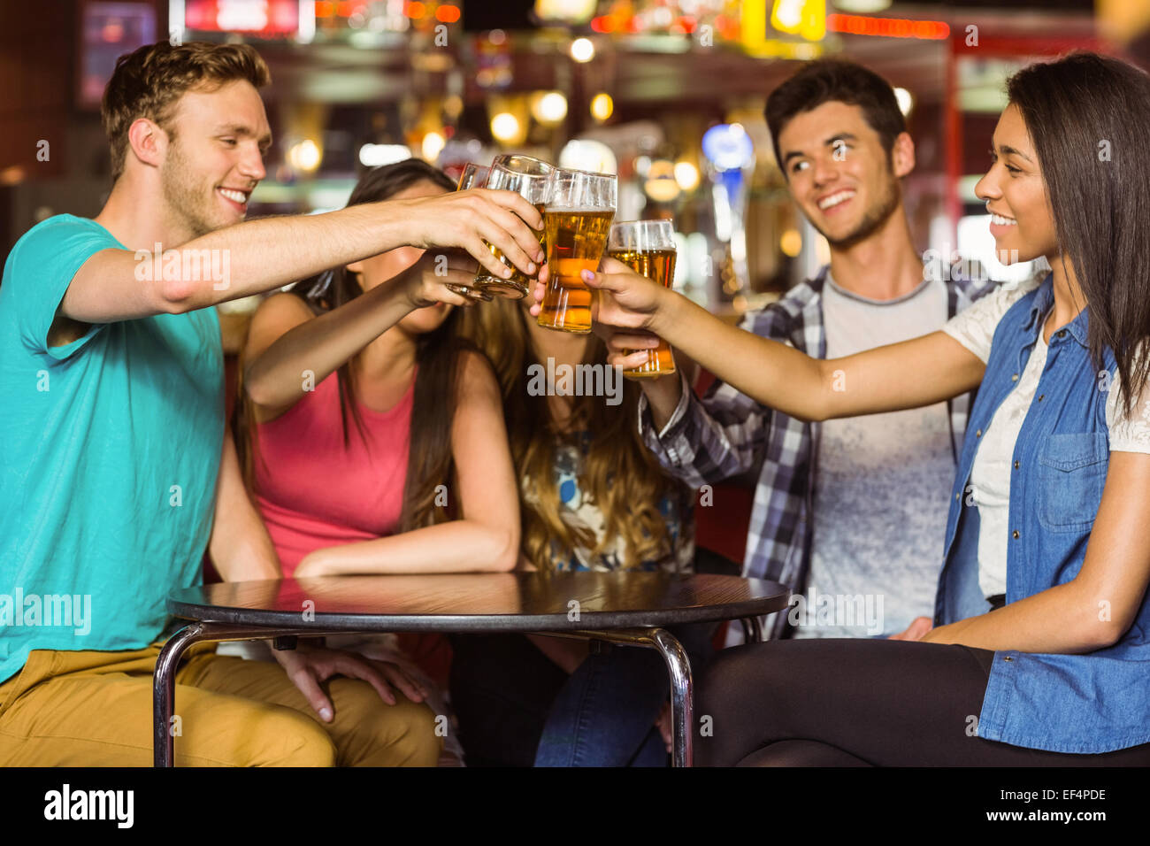 Happy friends toasting with drink and beer Stock Photo - Alamy